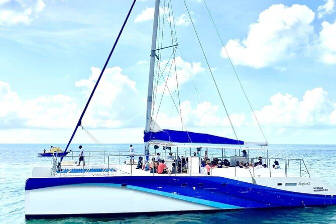 Private Isla Mujeres Sailing Catamaran Tour with Transportation - Key Points