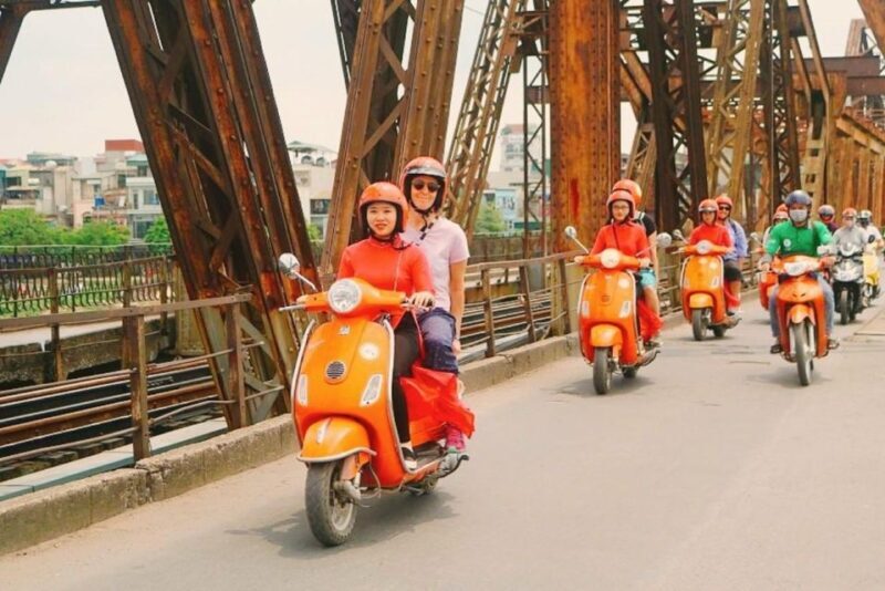 Red River delta & rural village with female Ao dai riders - A Scenic Ride Through Hanoi’s Countryside