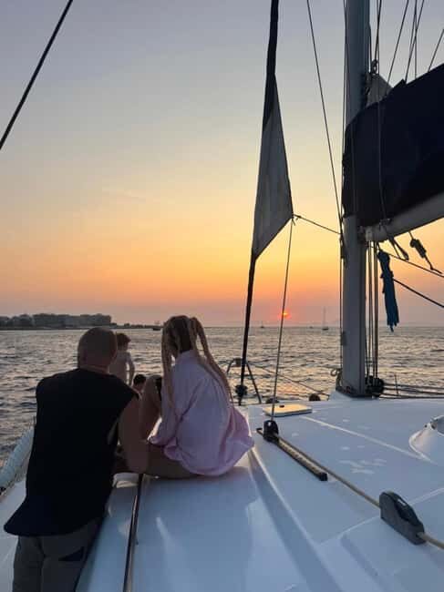 Rhodes: Sunset Catamaran Cruise with Snack, Fruits & Drinks - An Authentic and Relaxing Sunset Experience