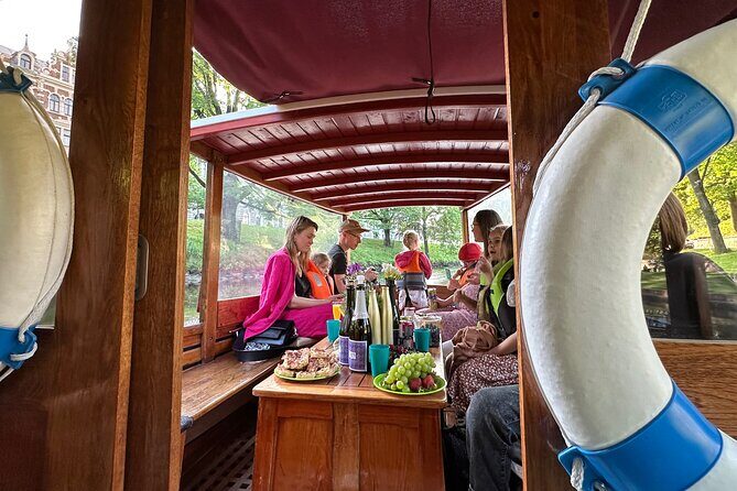 Riga: Evening or Sunset Boat Tour with Drink and Audio Guide - Overview of the Experience