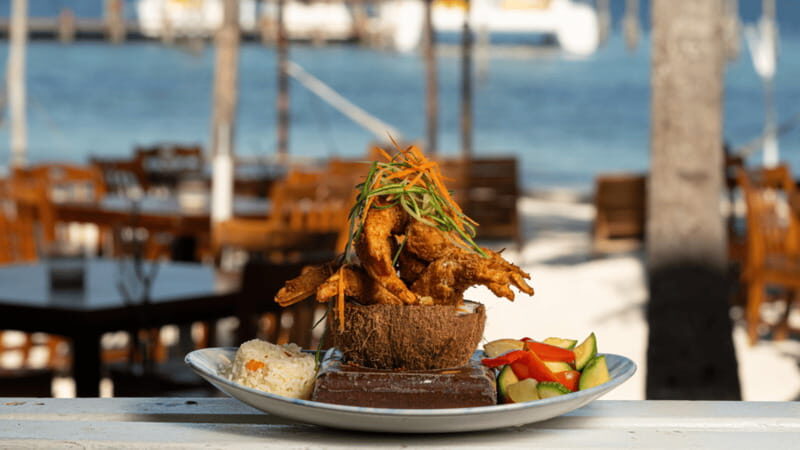 Romantic dinner in front of the sea - The Setting: An Oceanfront Table with Sand on Your Feet