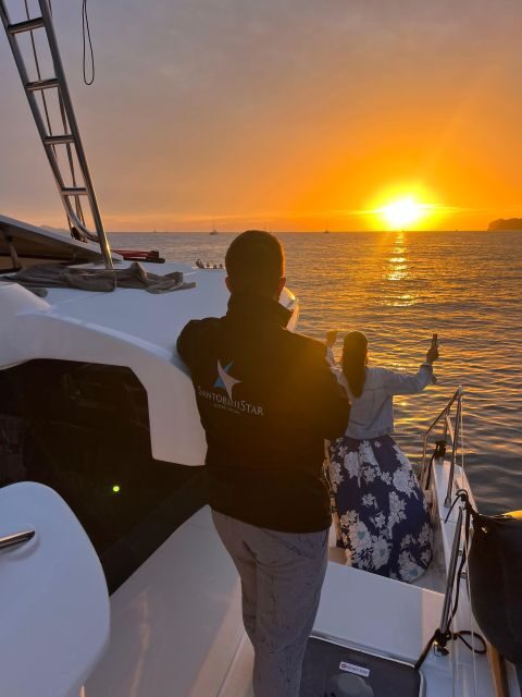 Santorini Catamaran Cruise with Swimming, Meal and Open Bar - Key Points