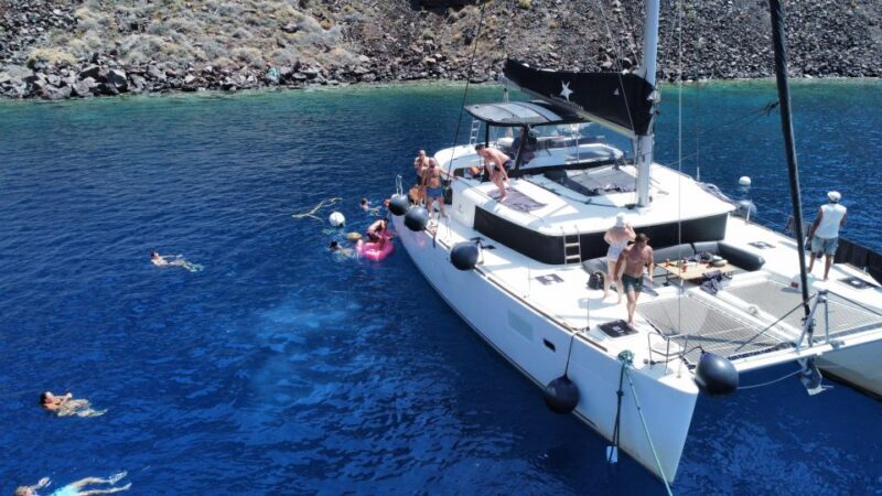 Santorini Catamaran Cruise with Swimming, Meal and Open Bar - Authentic Experiences in Every Dip and Bite