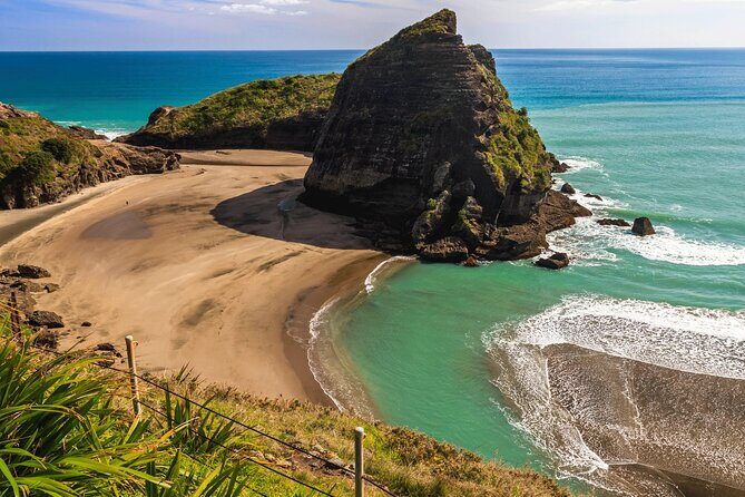 Sheep World and West Auckland Discovery Small Group Day Tour - Piha Beach: Iconic Black-Sand Coastline
