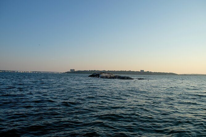 Small Group Sunset Lighthouse Boat Cruise With Local Drinks - The Itinerary: Stops and Highlights