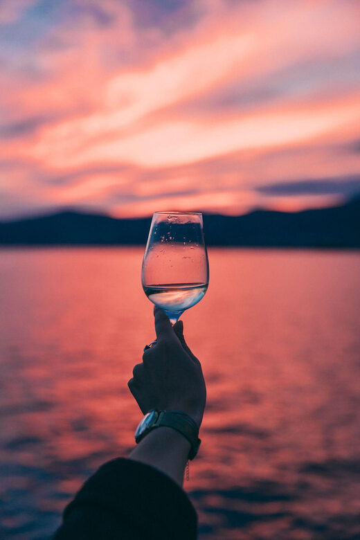 Sunset panoramic cruise with drinks and nighttime dip - Key Points