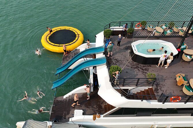 The Halong Catamaran Cruise Luxury Day Tour with Water Slide - Exploring the Bay: Scenic Cruising and Activities