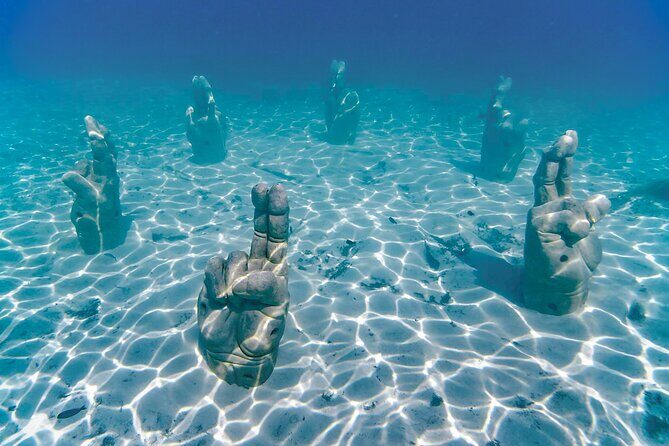 Top Isla Mujeres Catamaran Tour with Snorkel Open Bar and Buffet lunch - Who Should Consider This Tour?