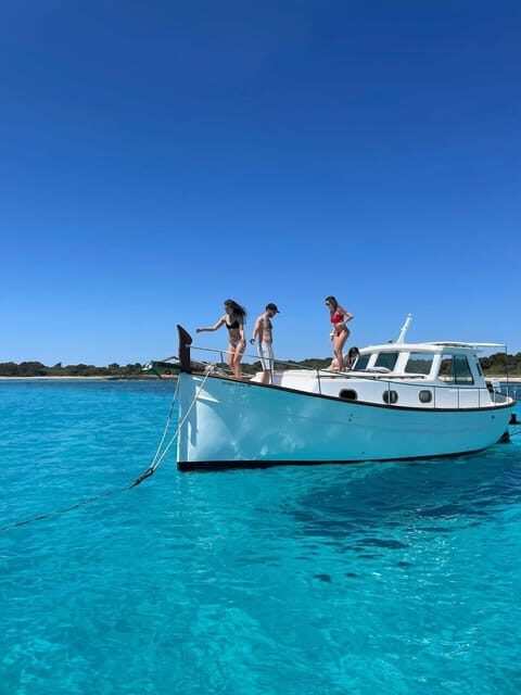 Traditional boat 10 beaches in the south of Menorca. Snorkeling, SUP and drinks - The Bottom Line