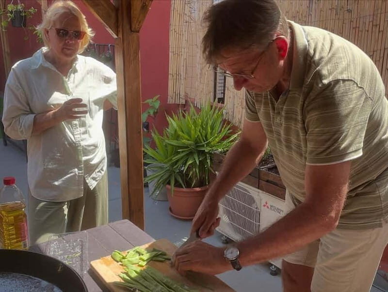 Valencia: Paella Cooking Class with Tapas and Drinks - Making the Dish: From Kitchen to Plate