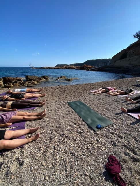 Yoga class on the beach in Ibiza - The Sum Up